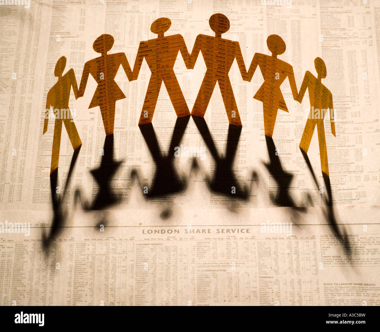 Financial Times Paper men and women cut outs in pink Stock Photo - Alamy