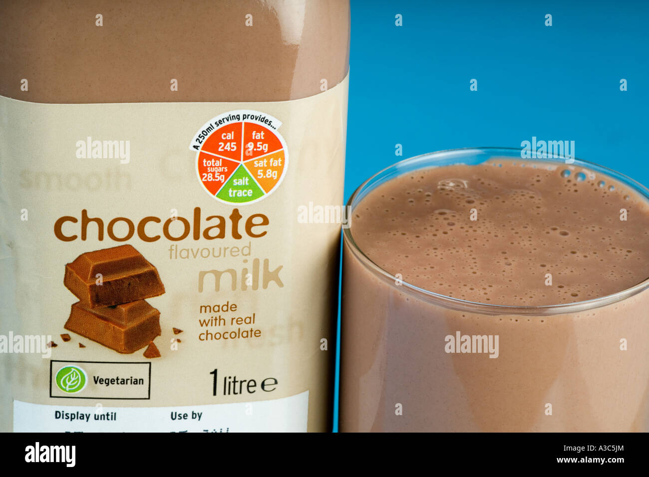 Chocolate flavoured milk package and glass with nutritional information ...