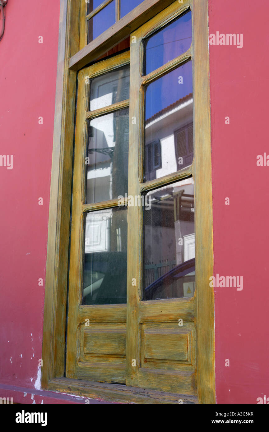 traditional tall double opening wood and glass window of a house in ...