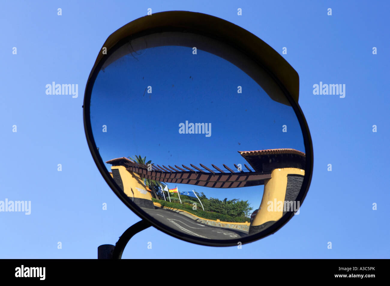 convex security mirror used as a driving and traffic aid opposite and ...