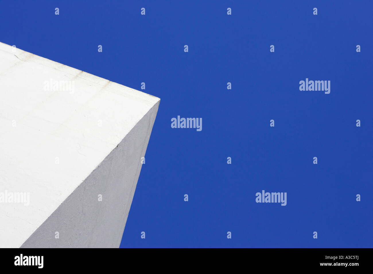 angular corner of traditonal flat roofed white washed spanish home ...