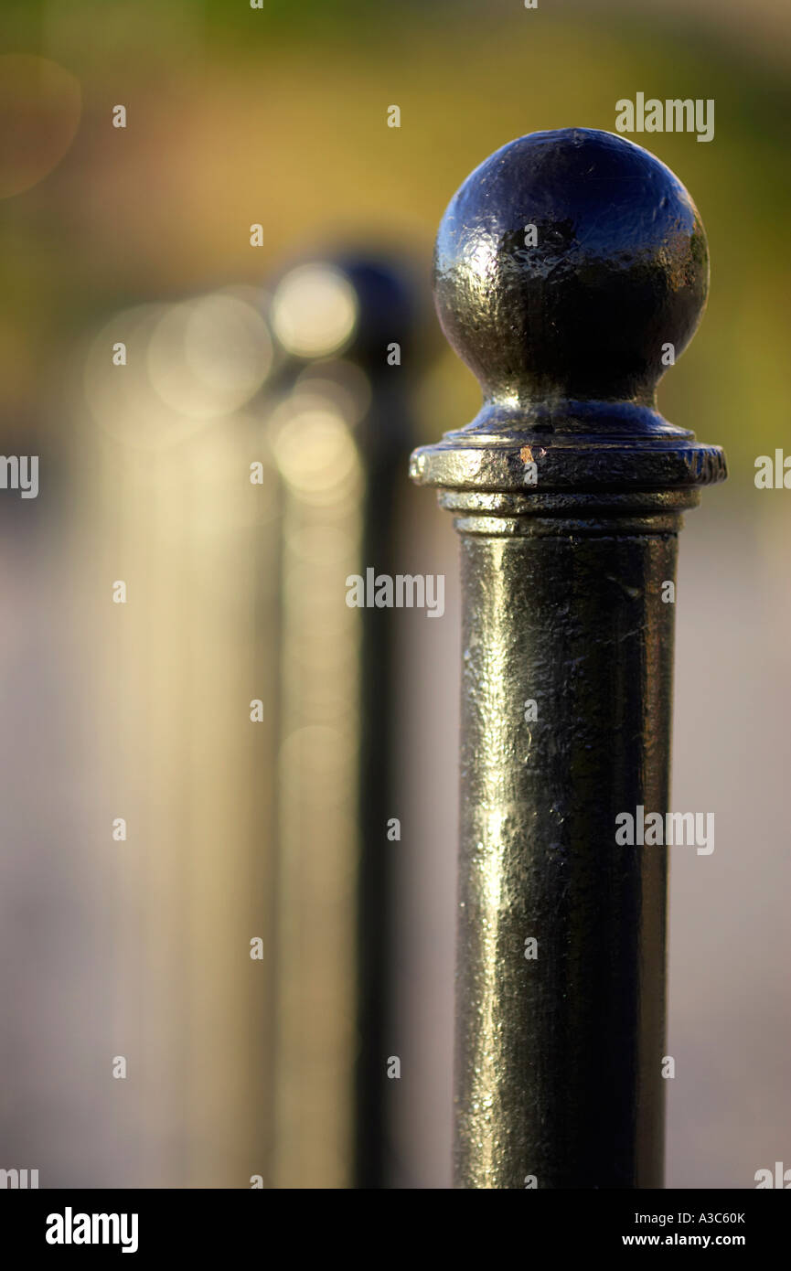 row of black metal posts in the main square in puerto de santiago ...