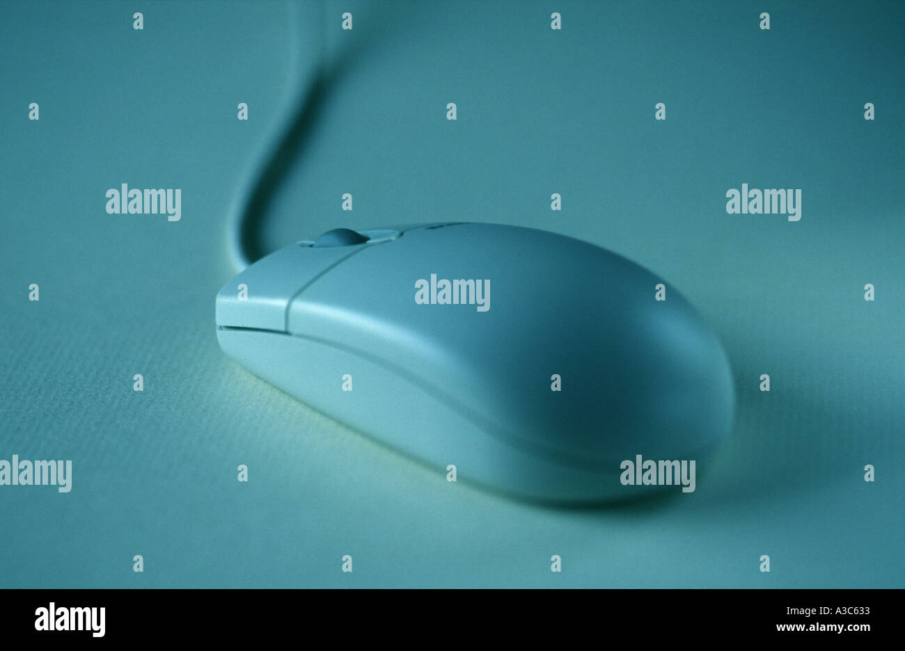 Computer mouse coloured pale blue Stock Photo - Alamy