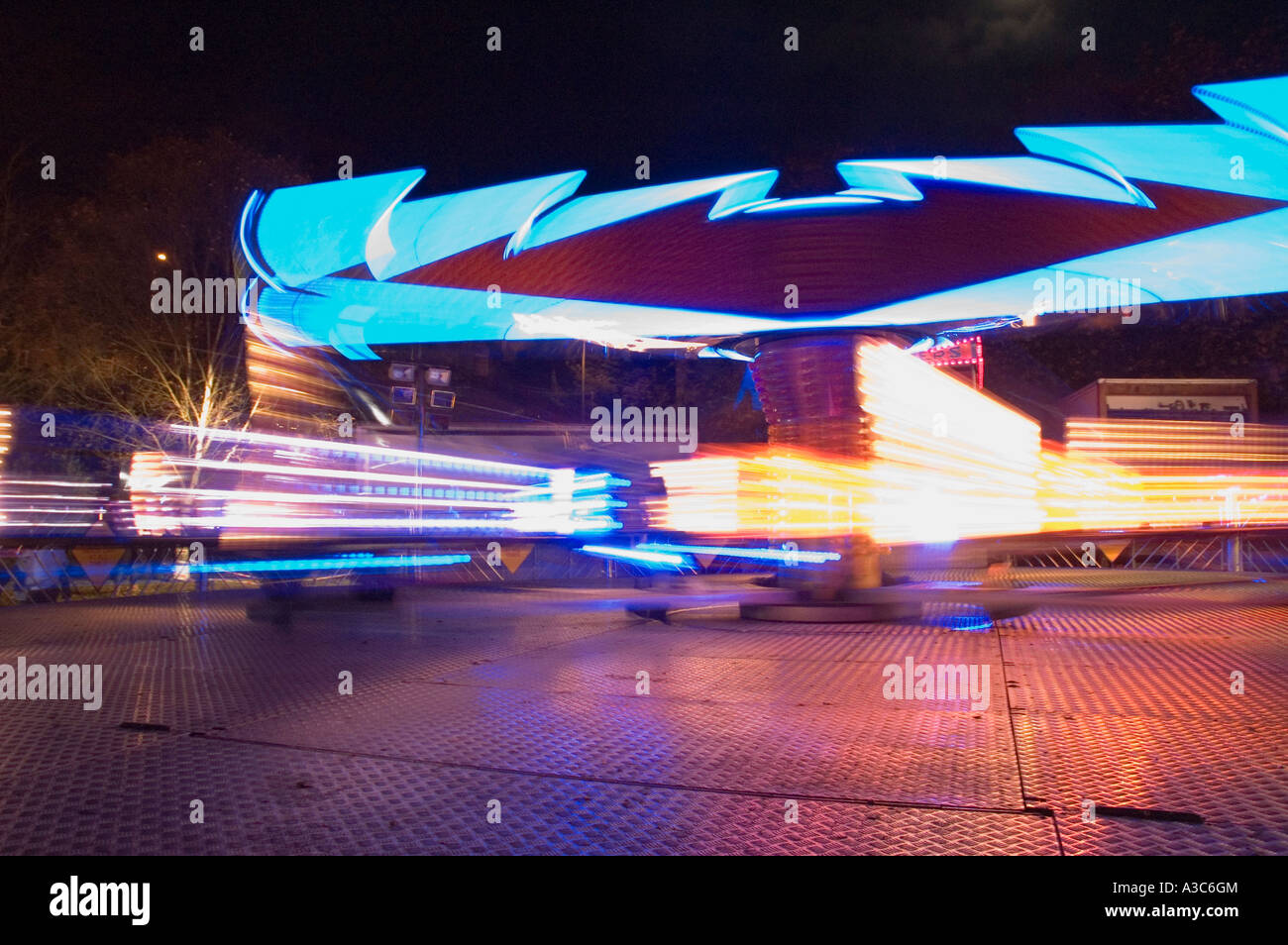 Fairground ride at night Stock Photo - Alamy