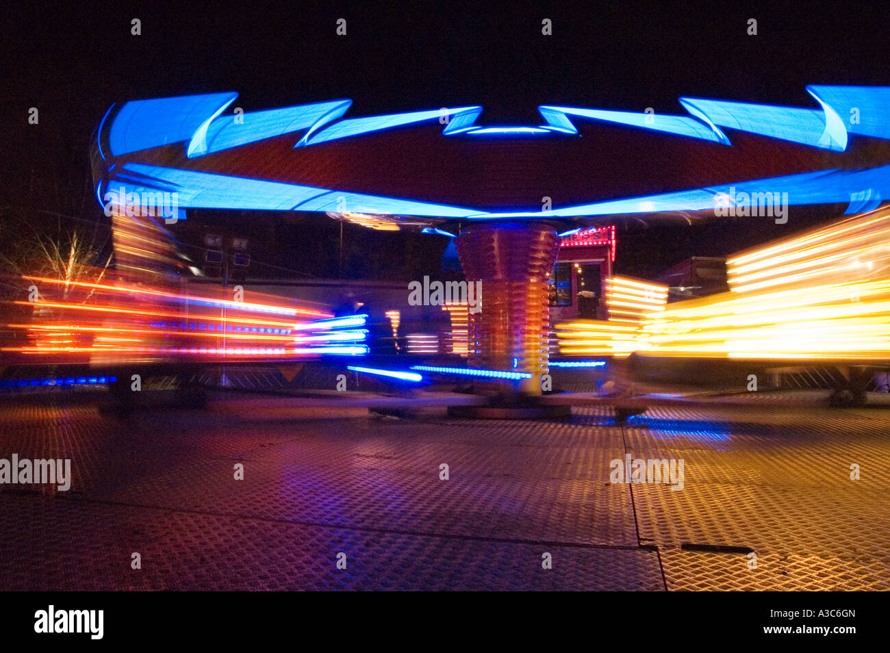 Fairground ride at night Stock Photo - Alamy