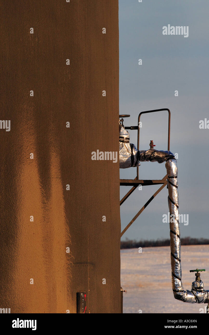 Oil tank on well site Stock Photo - Alamy