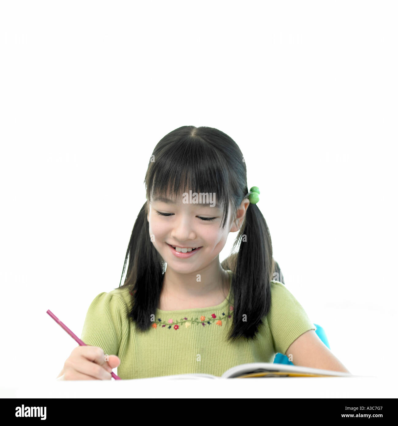 Child girl student writing Cut Out Stock Images & Pictures - Alamy