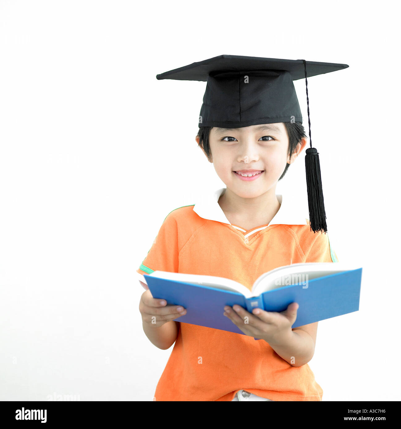 Education opened book graduation cap hi-res stock photography and ...