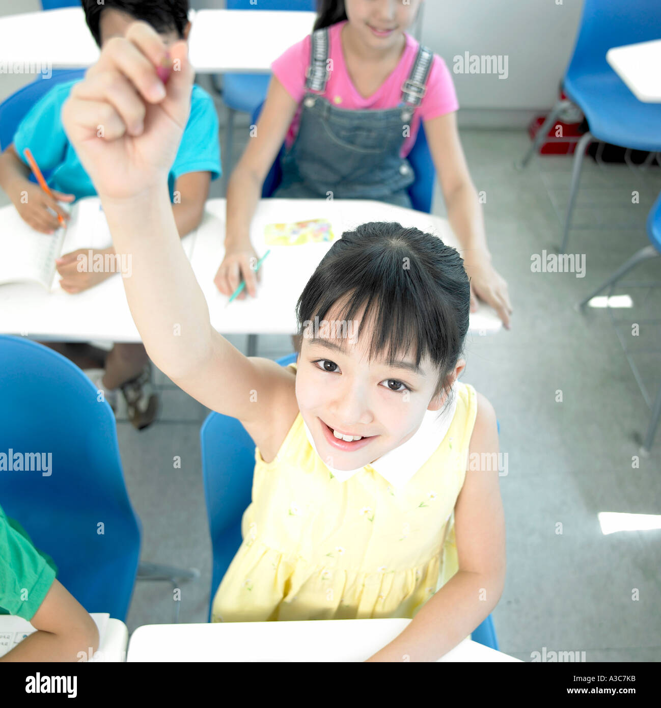 A girl rasing her hand Stock Photo - Alamy