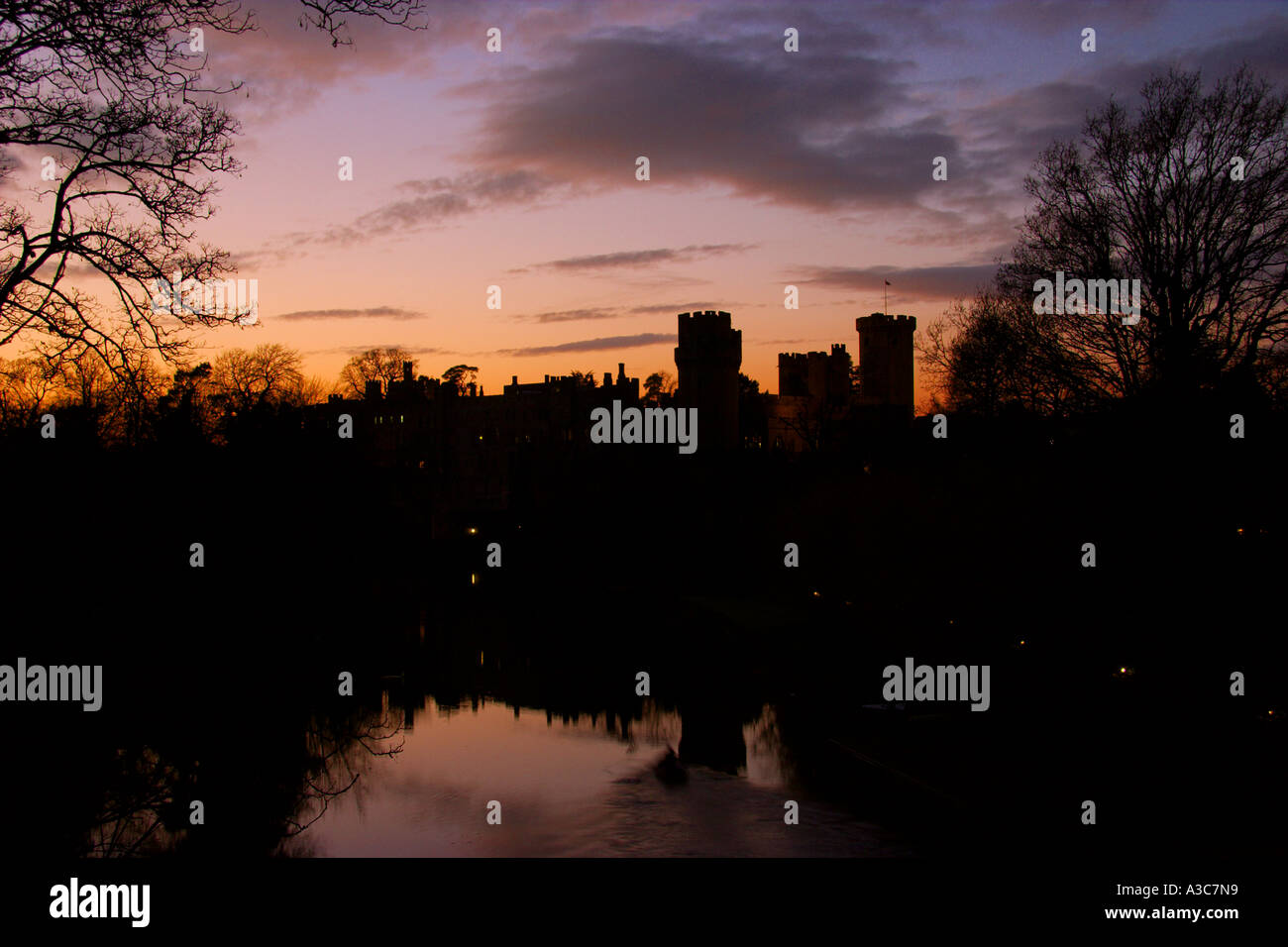 Warwick Castle silhouette with sunset and the River Avon Stock Photo ...