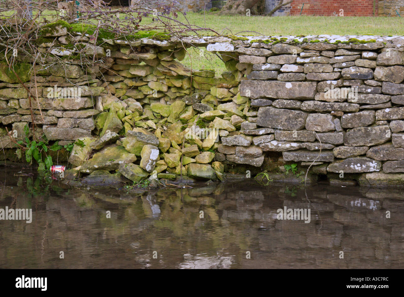 Collapsed stone wall Stock Photo - Alamy