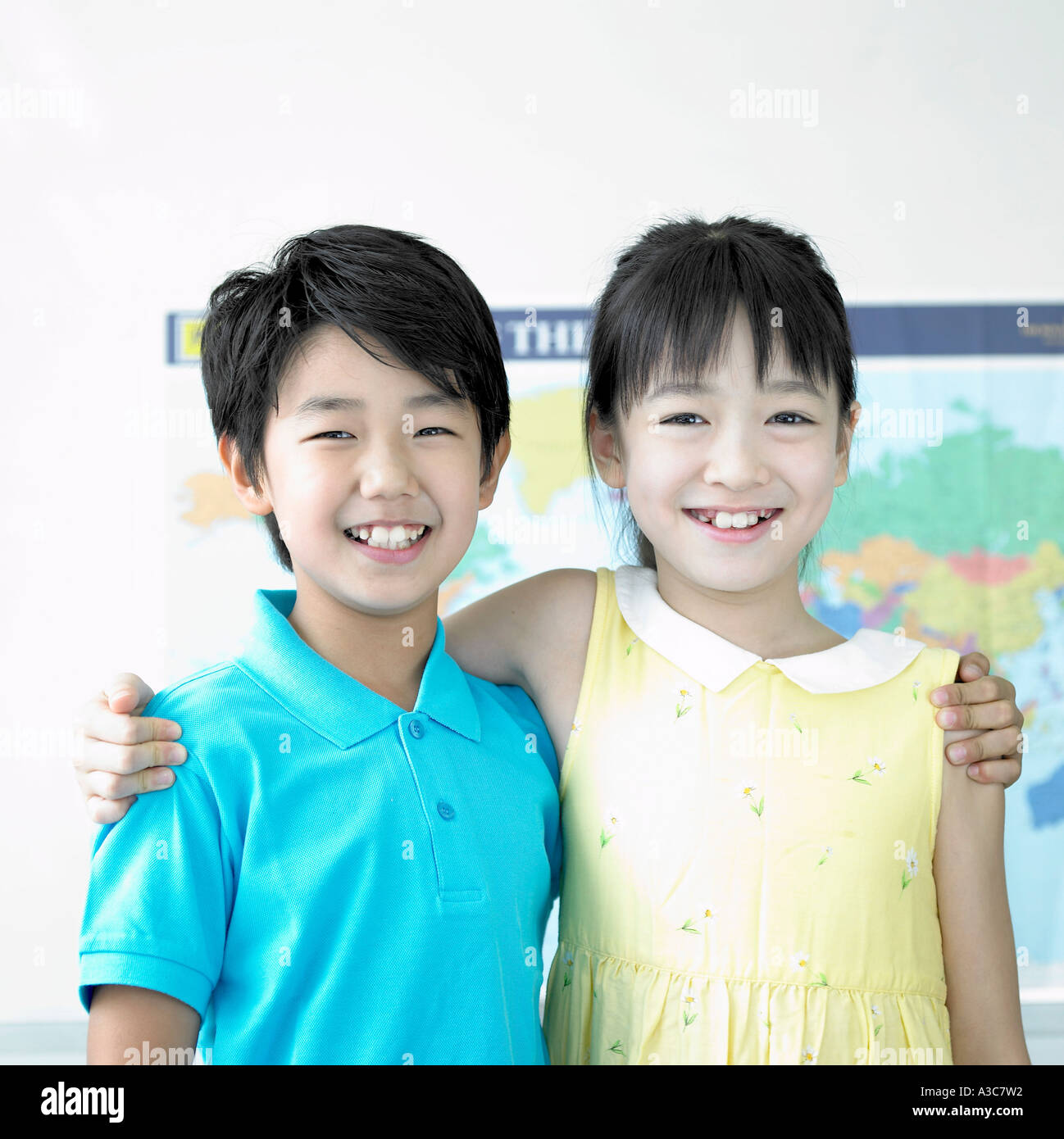A boy and girl in friendly pose Stock Photo - Alamy