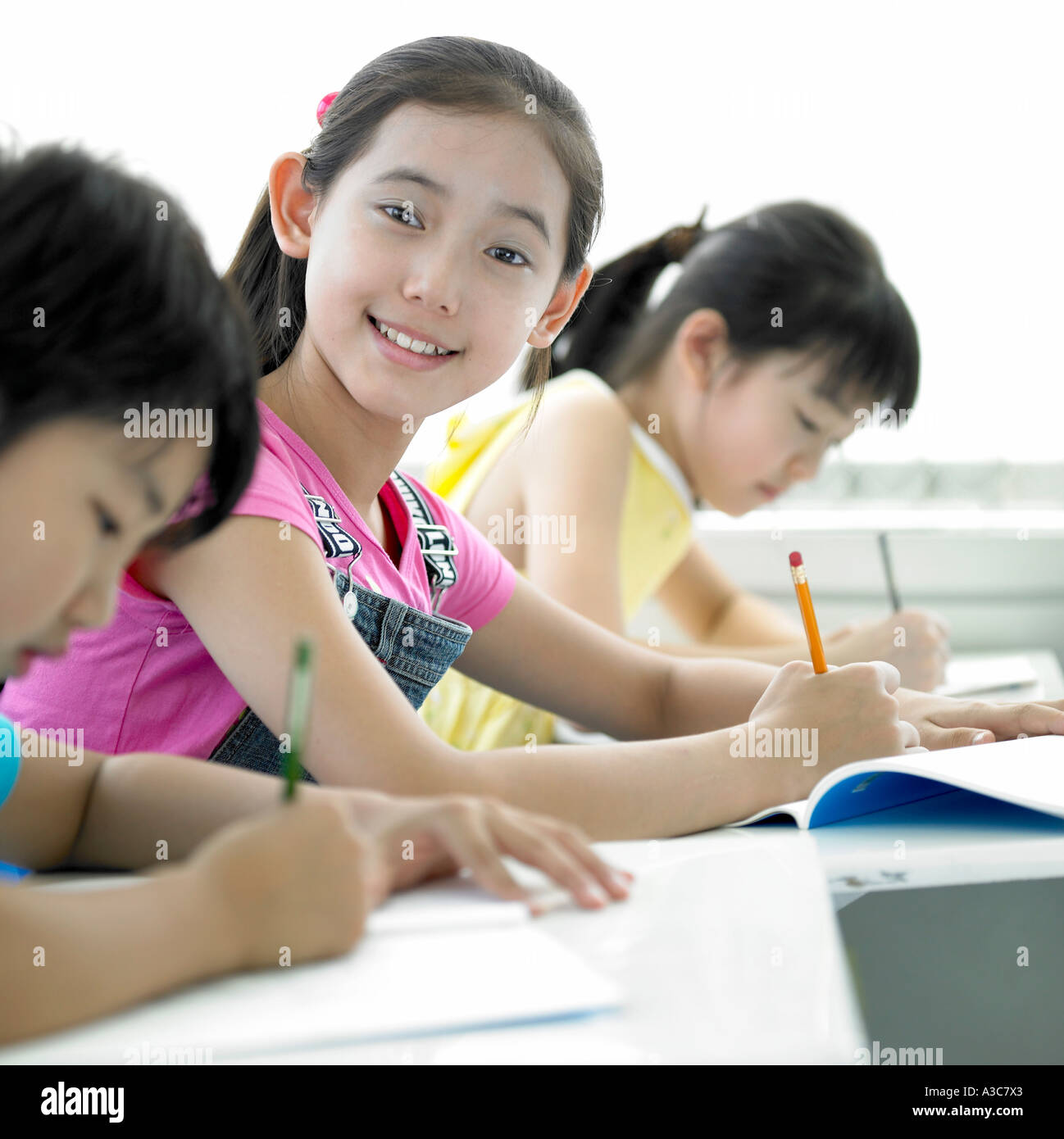Children studying in the classroom Stock Photo - Alamy