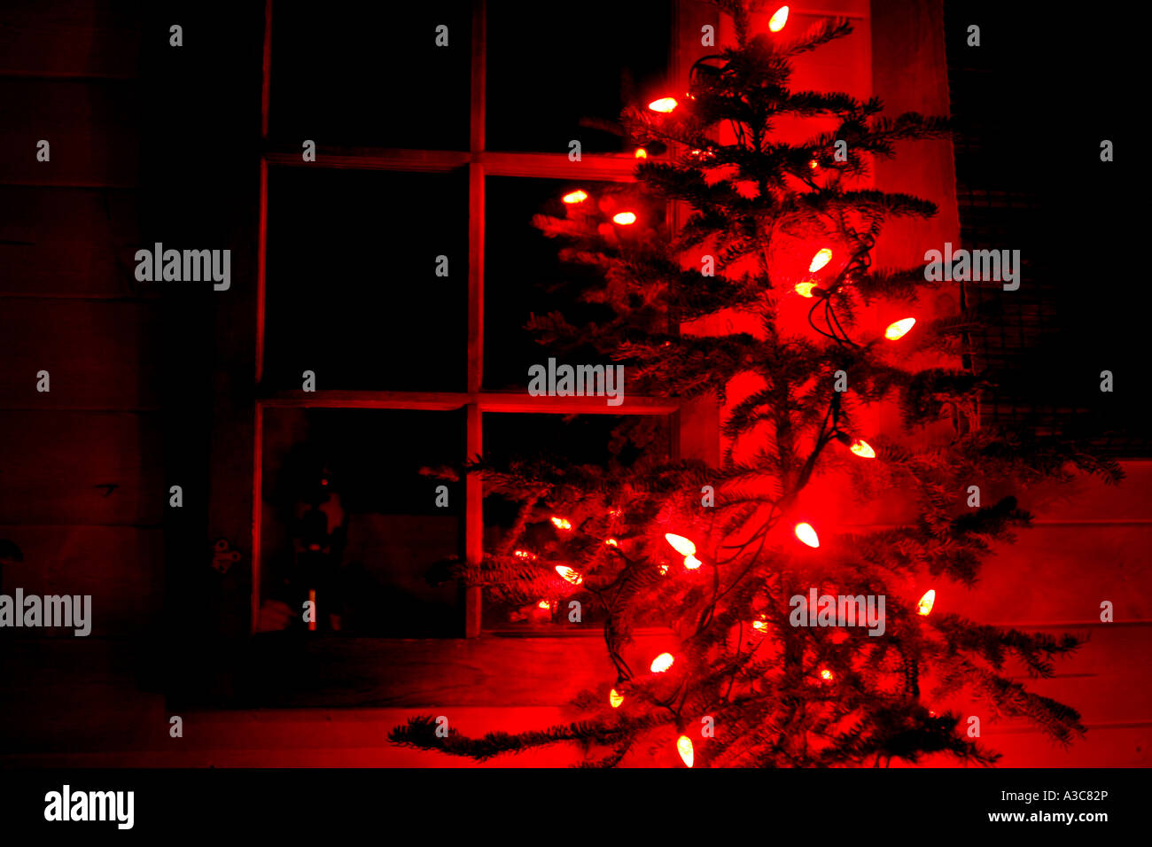Red lights on a Christmas tree Stock Photo - Alamy