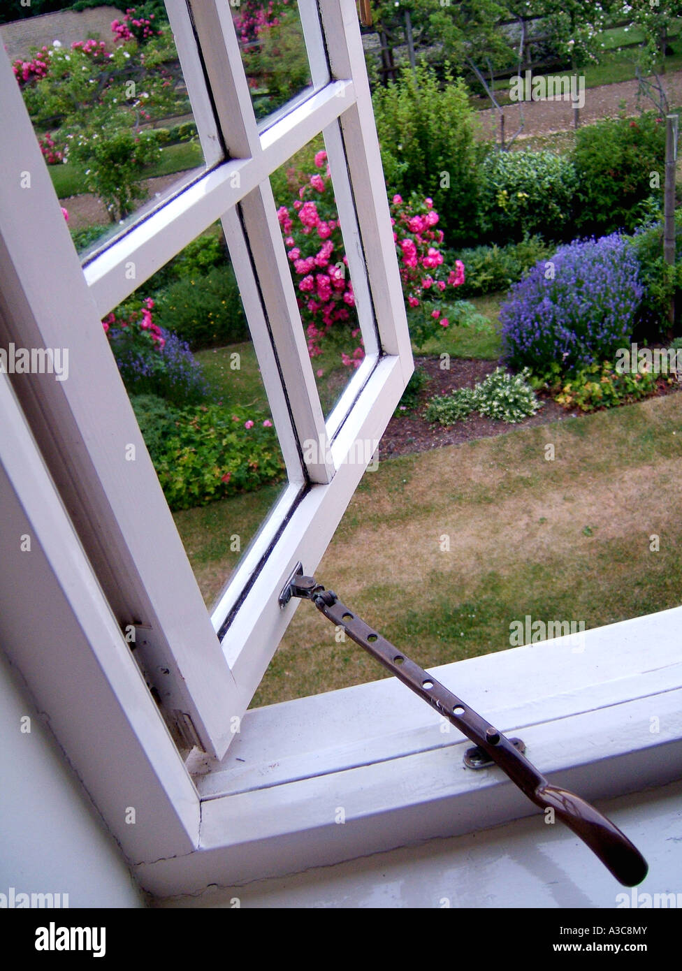 Open window onto flower garden Stock Photo - Alamy