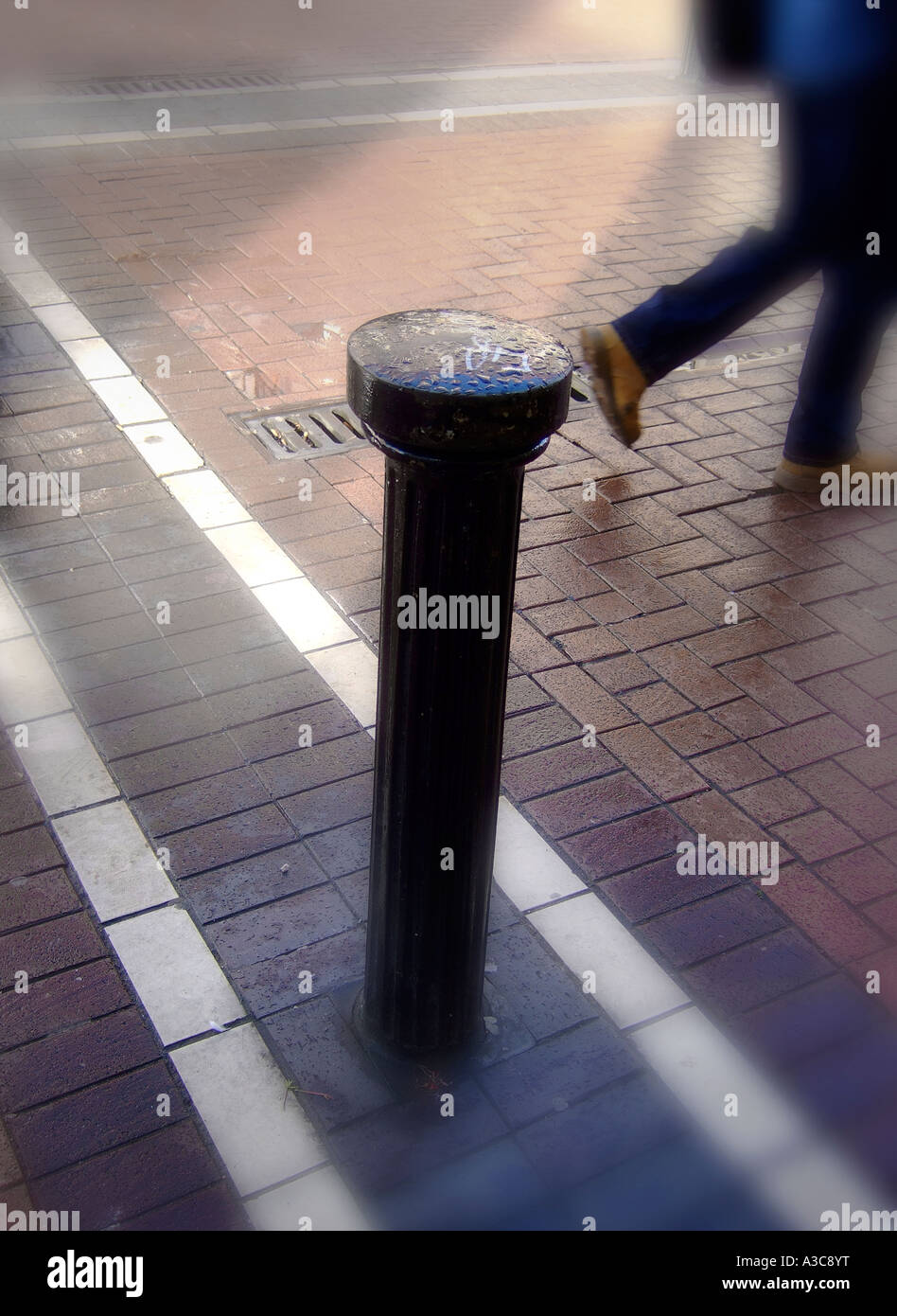 man walking past post Stock Photo - Alamy