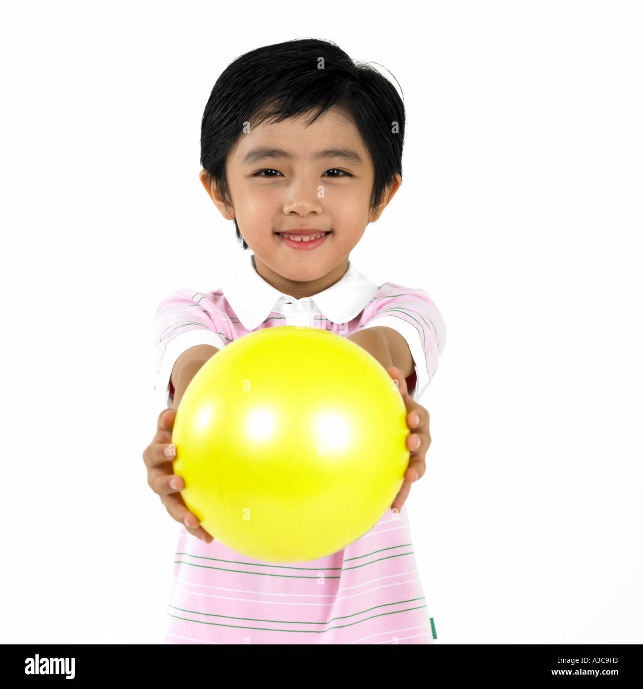 boy holding ball Stock Photo - Alamy
