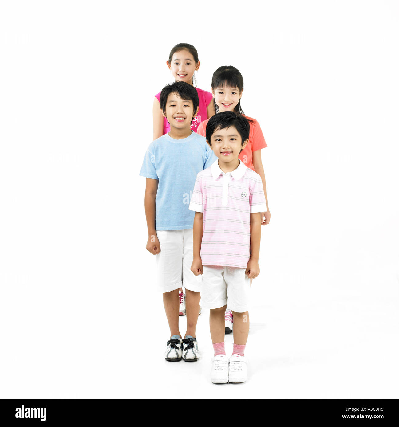 Children standing in a row Stock Photo - Alamy