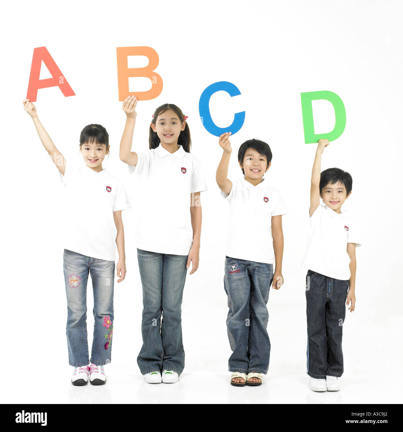 Children holding alphabet letters hi-res stock photography and images ...
