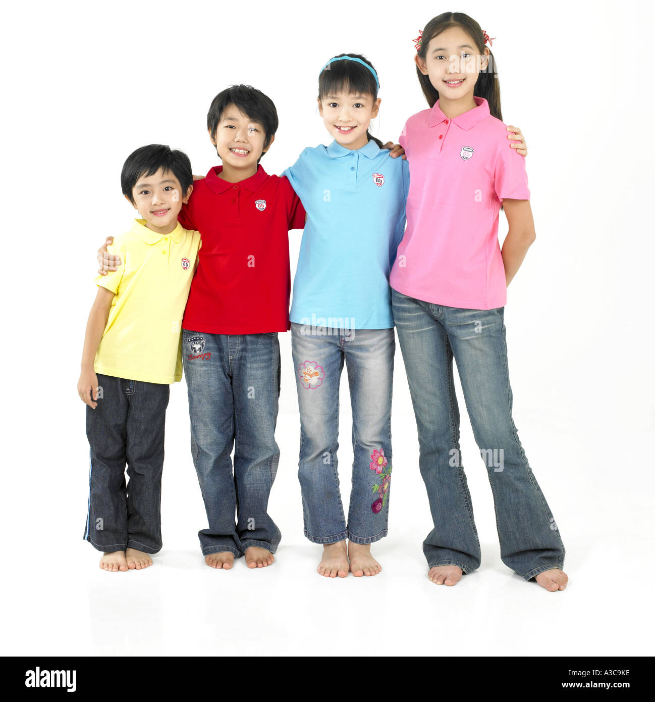 Children standing arm in arm Stock Photo - Alamy