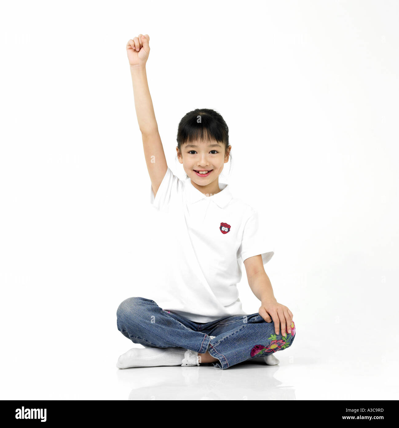 Girl raising her hands Stock Photo - Alamy