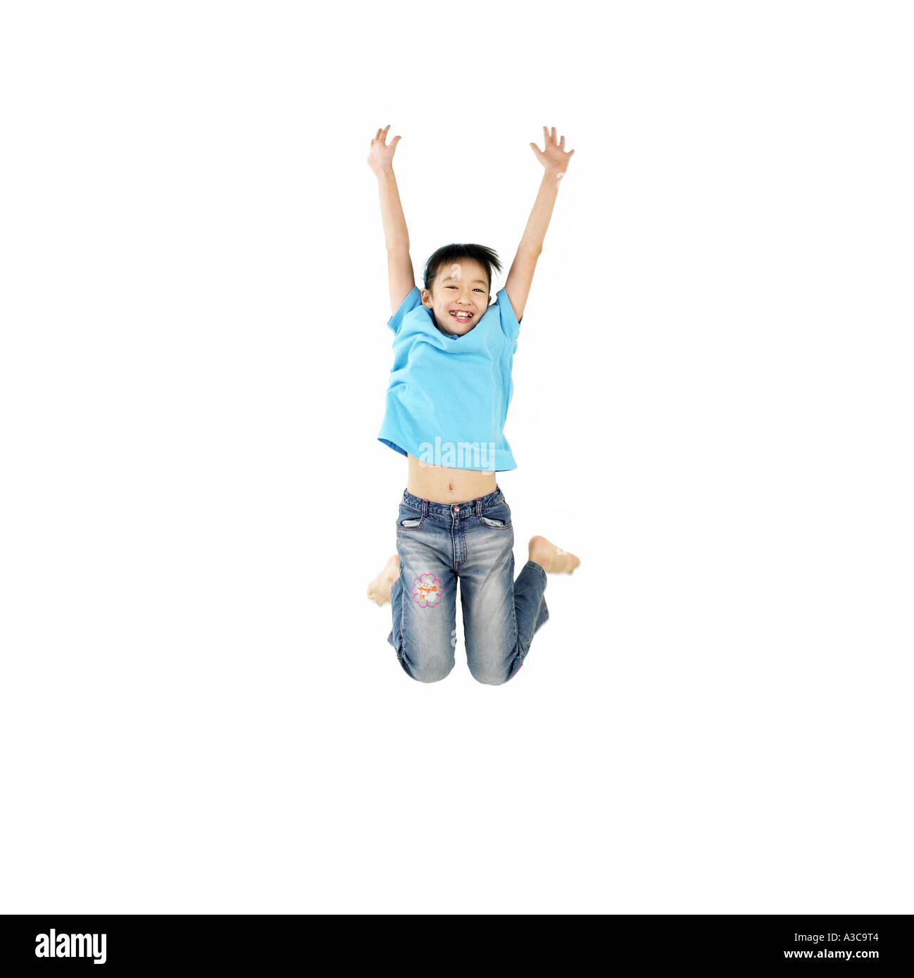 Girl jumping up Stock Photo - Alamy