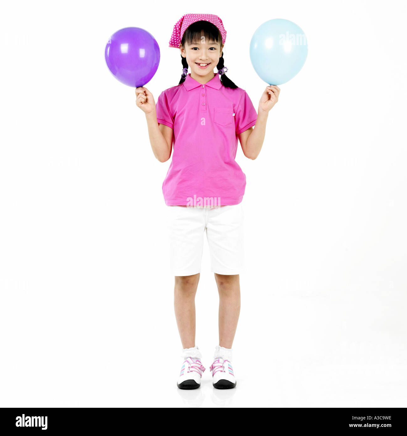 Girl holding balloon Cut Out Stock Images & Pictures - Alamy