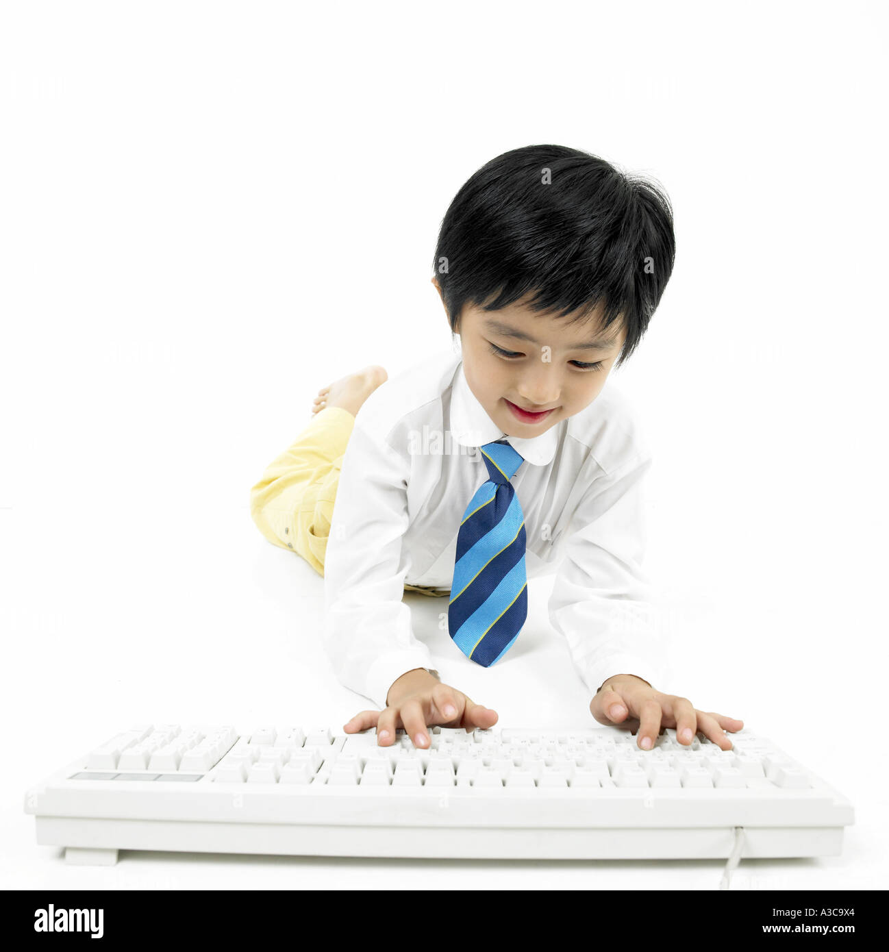 Boys using keyboard Stock Photo - Alamy