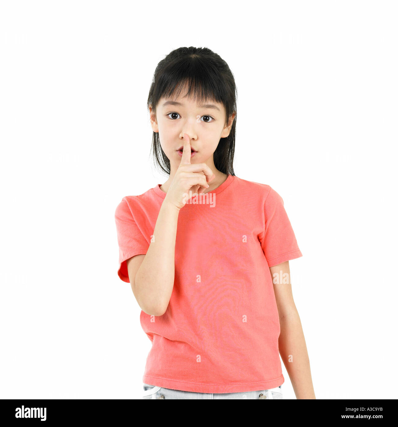 girl making gesture hush up and be quiet Stock Photo - Alamy