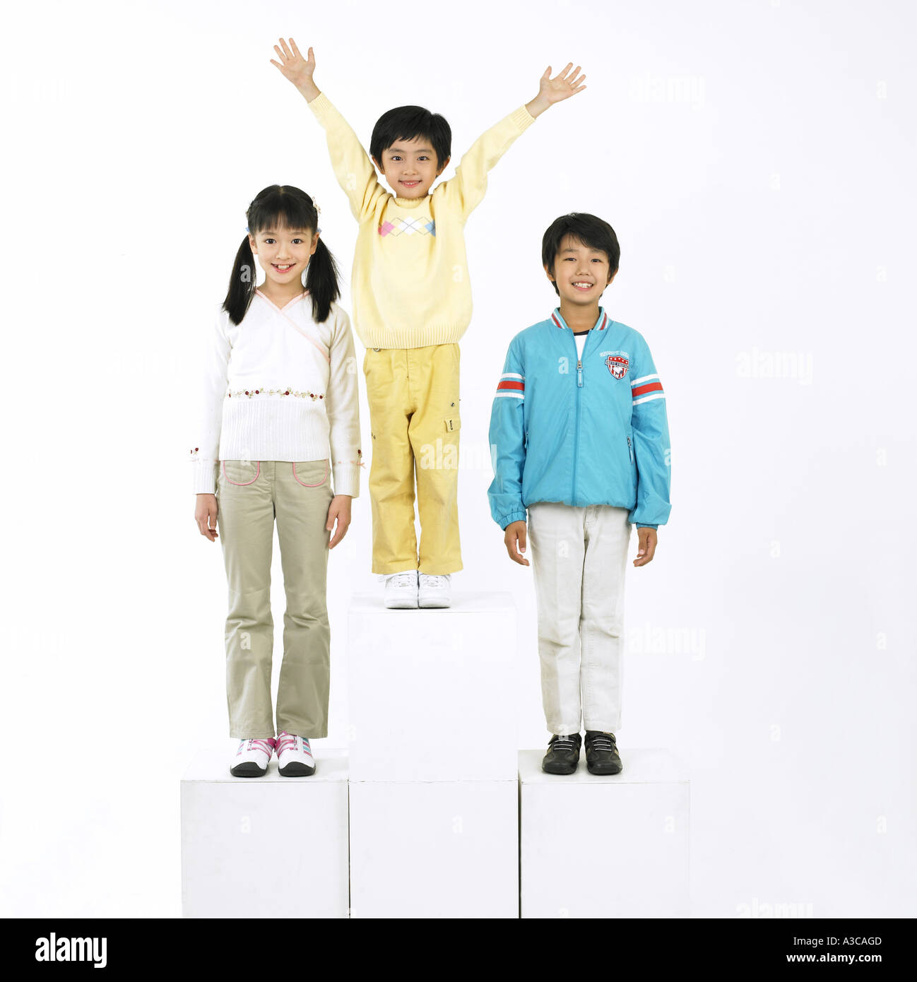 Child with two arms up for cheering and her friends Stock Photo - Alamy