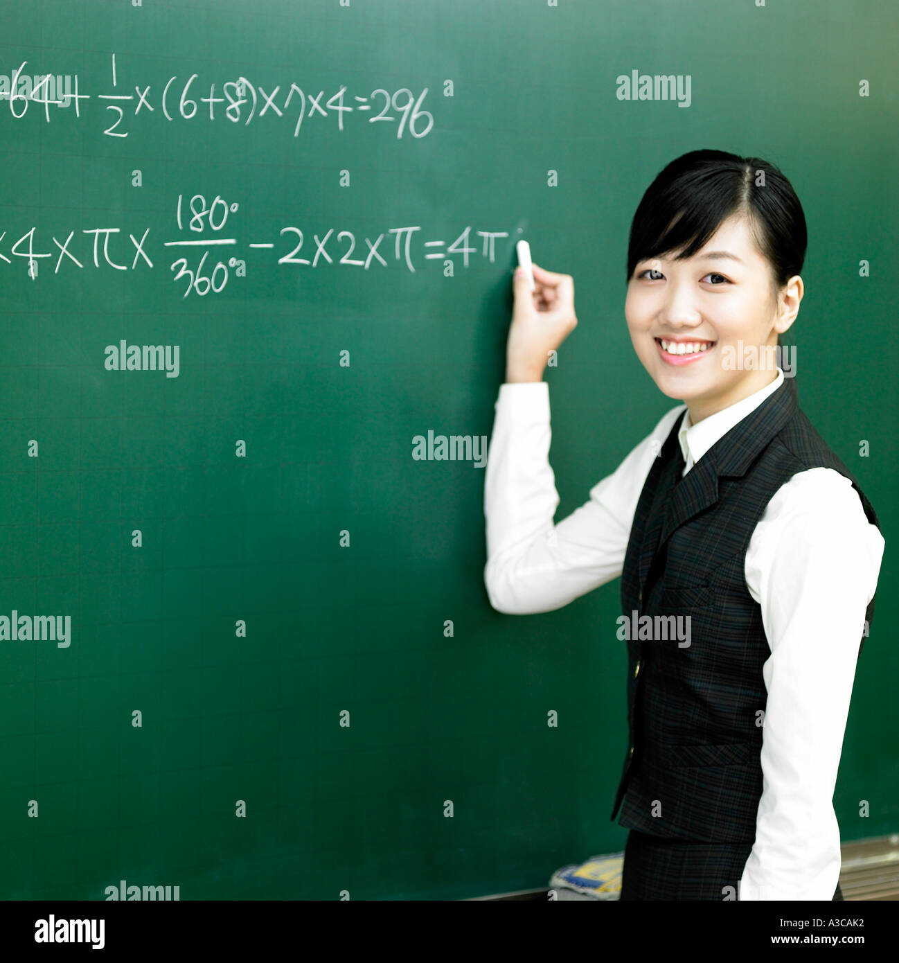 Woman writing mathematical formula hi-res stock photography and images ...