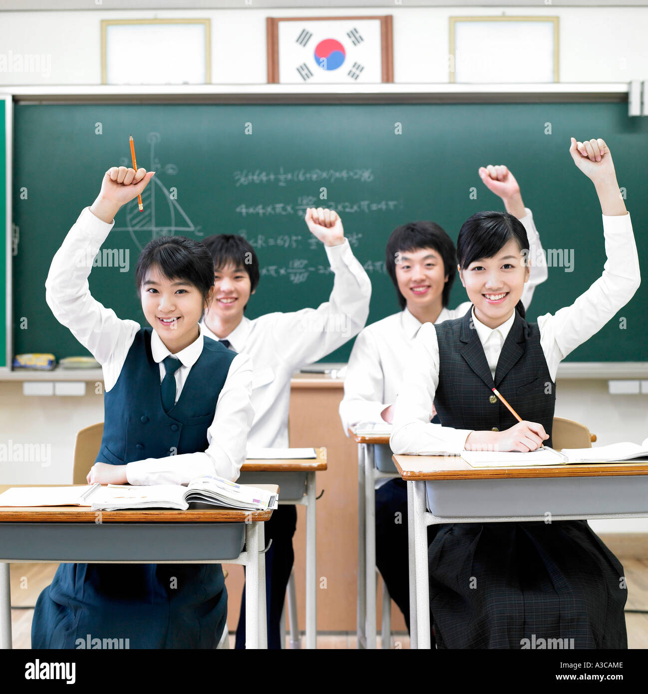 Students raising their hands Stock Photo - Alamy