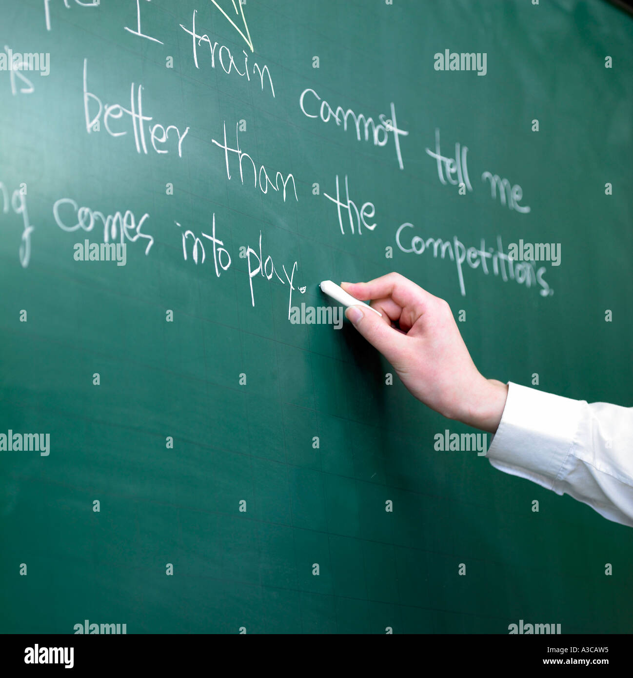 A student writing English sentences on the board Stock Photo - Alamy