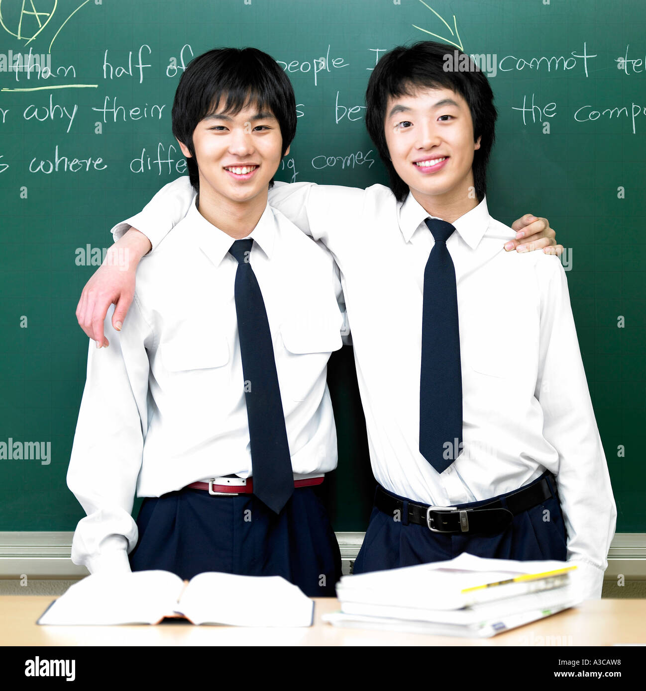 Two students in front blackboard hi-res stock photography and images ...