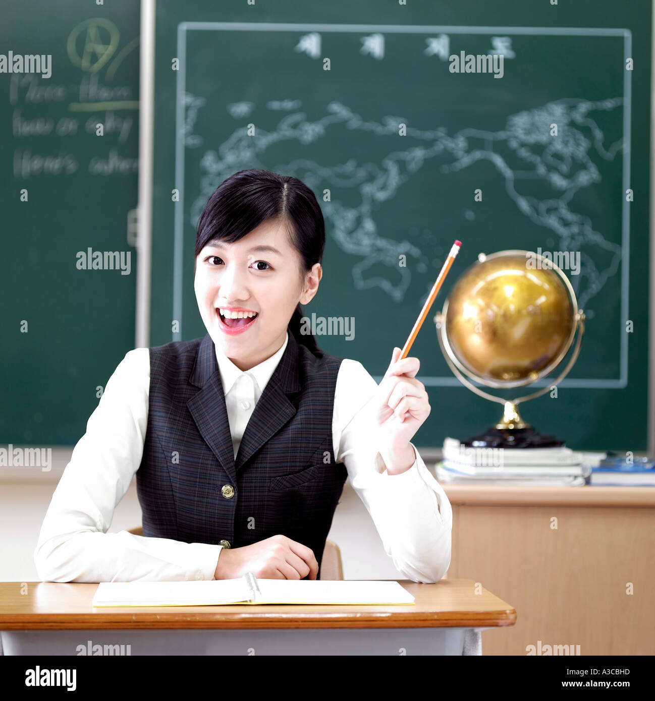 A student got an idea beside a globe Stock Photo - Alamy