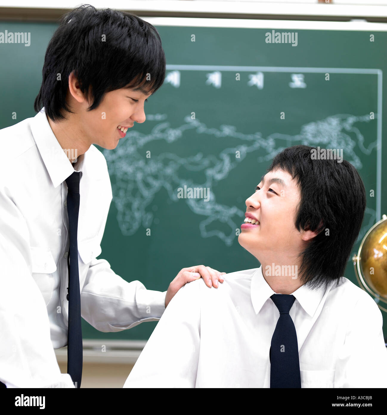 Two students having a conversation Stock Photo - Alamy