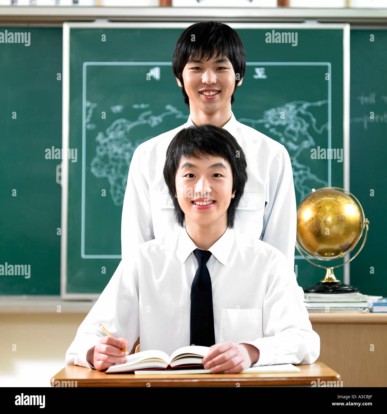 Two students facing the front Stock Photo - Alamy