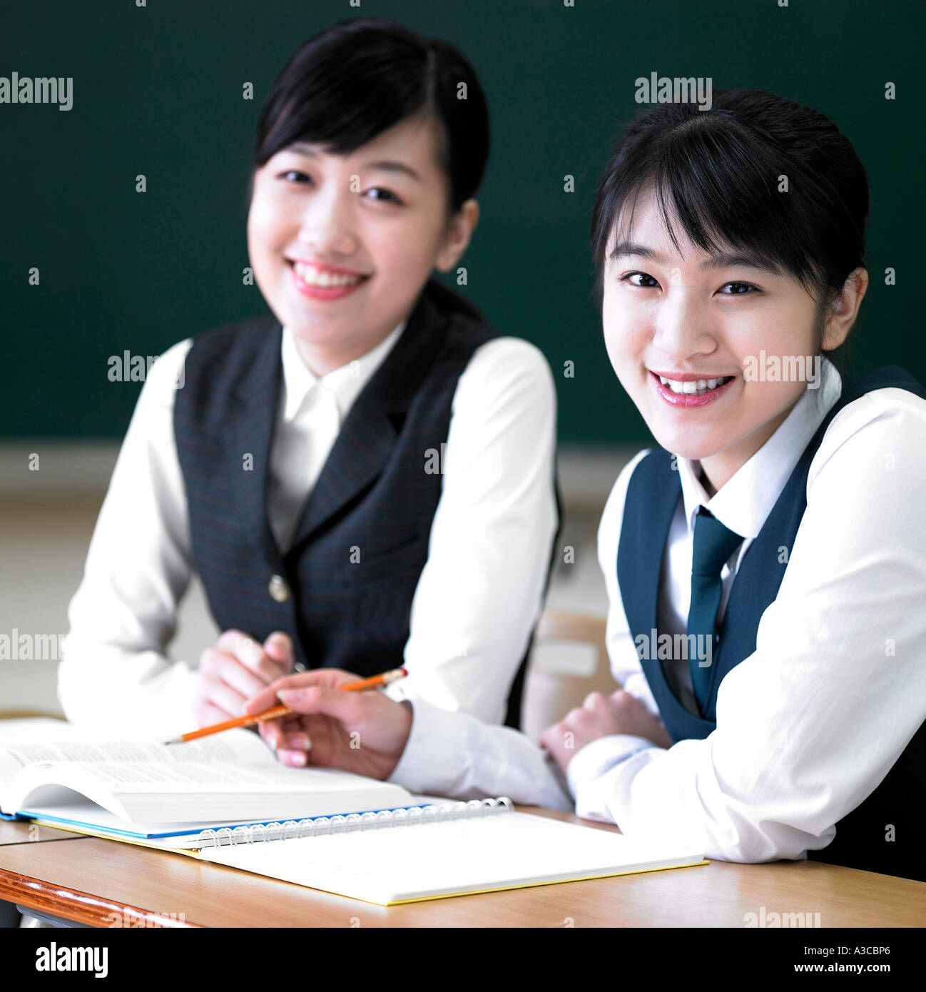Two students studying together Stock Photo - Alamy