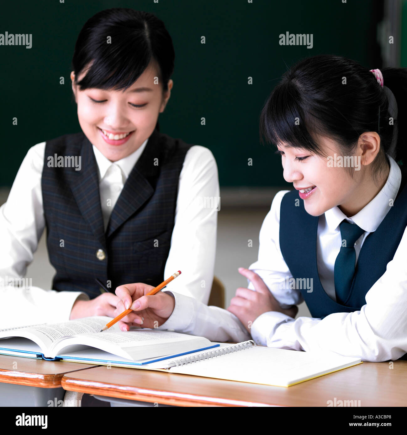Two students studying together Stock Photo - Alamy