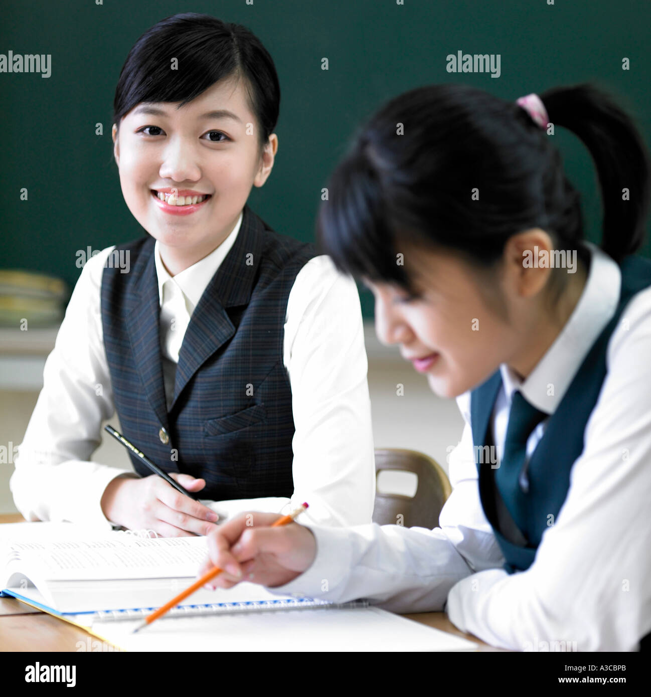 Two students studying together Stock Photo - Alamy