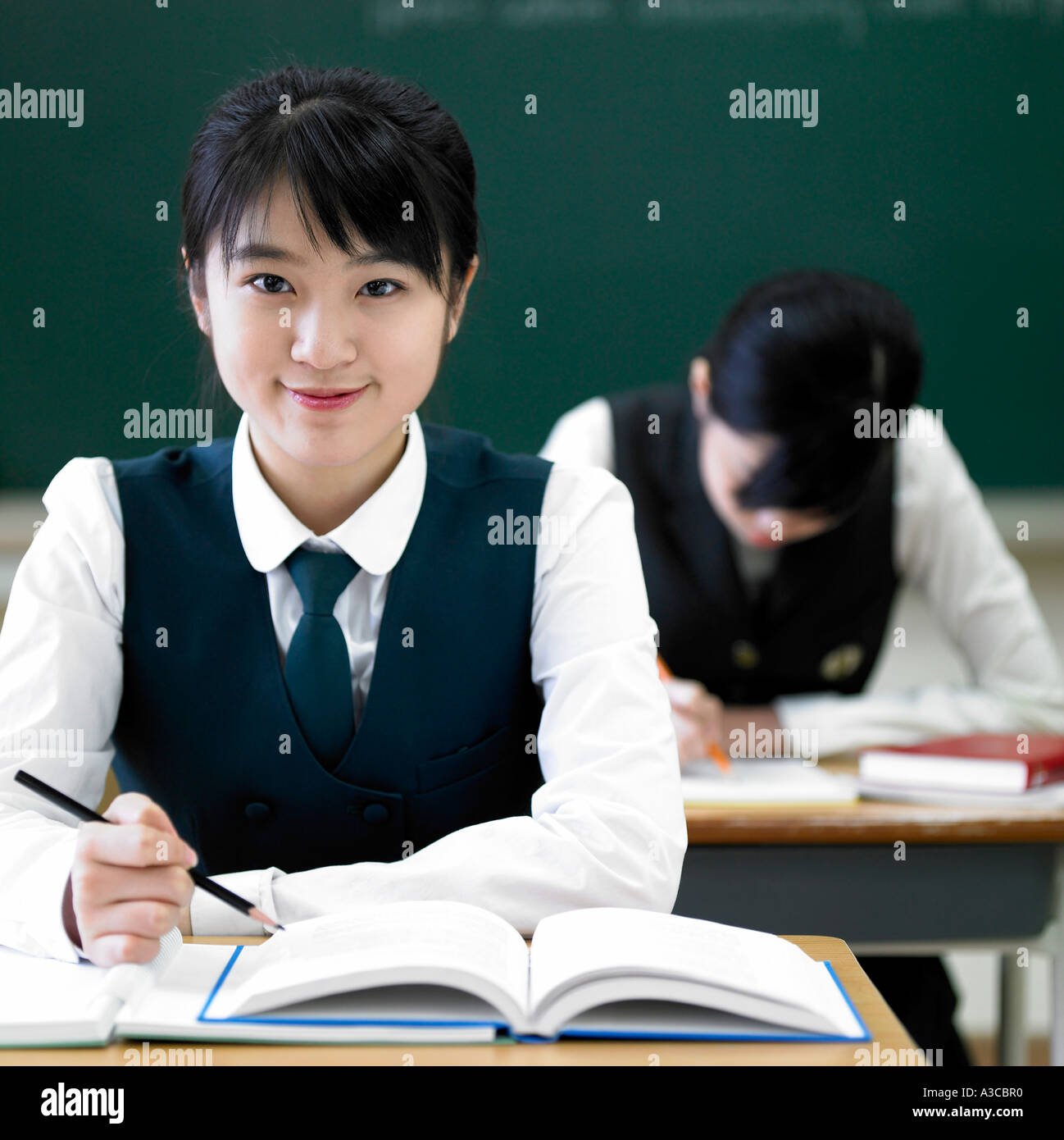 A student sitting straight Stock Photo - Alamy