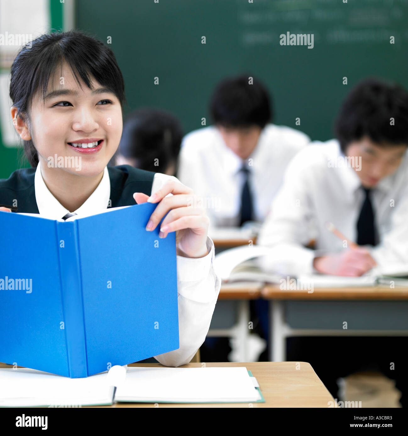 A student reading a book Stock Photo - Alamy