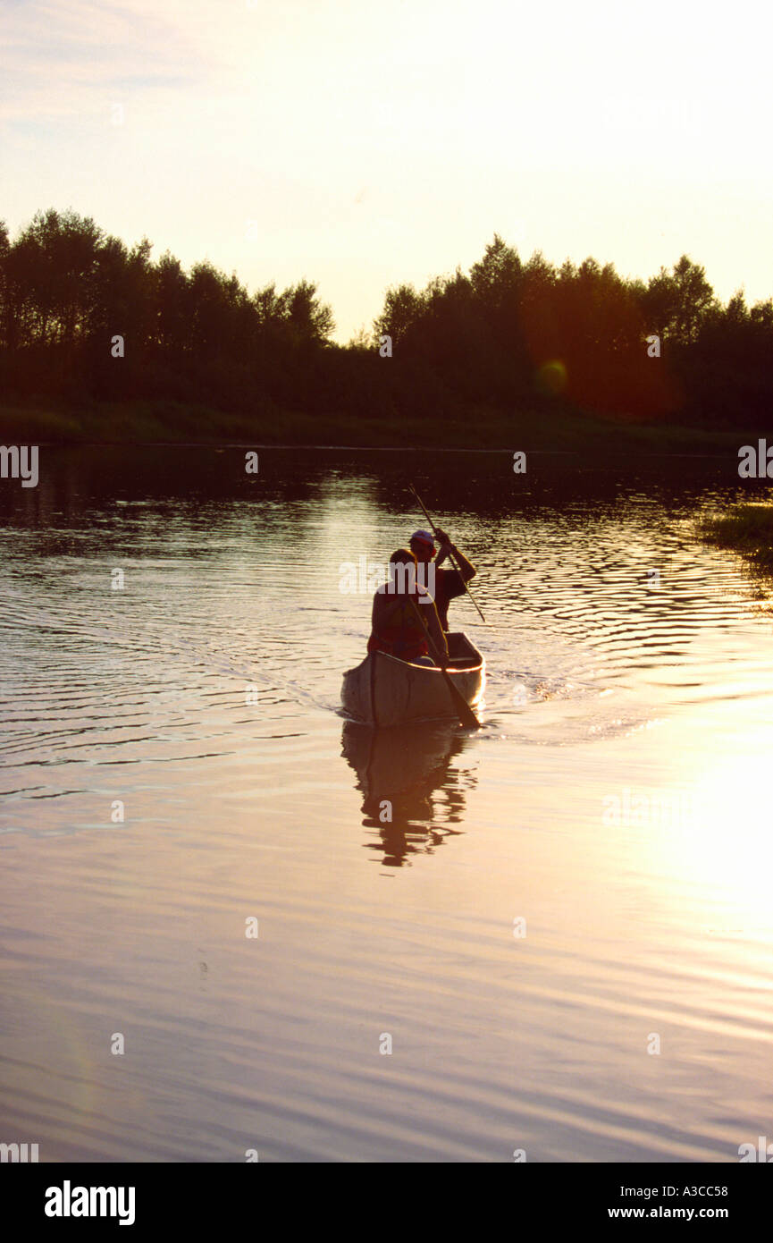 Canoe on river with sunset Canada Stock Photo - Alamy