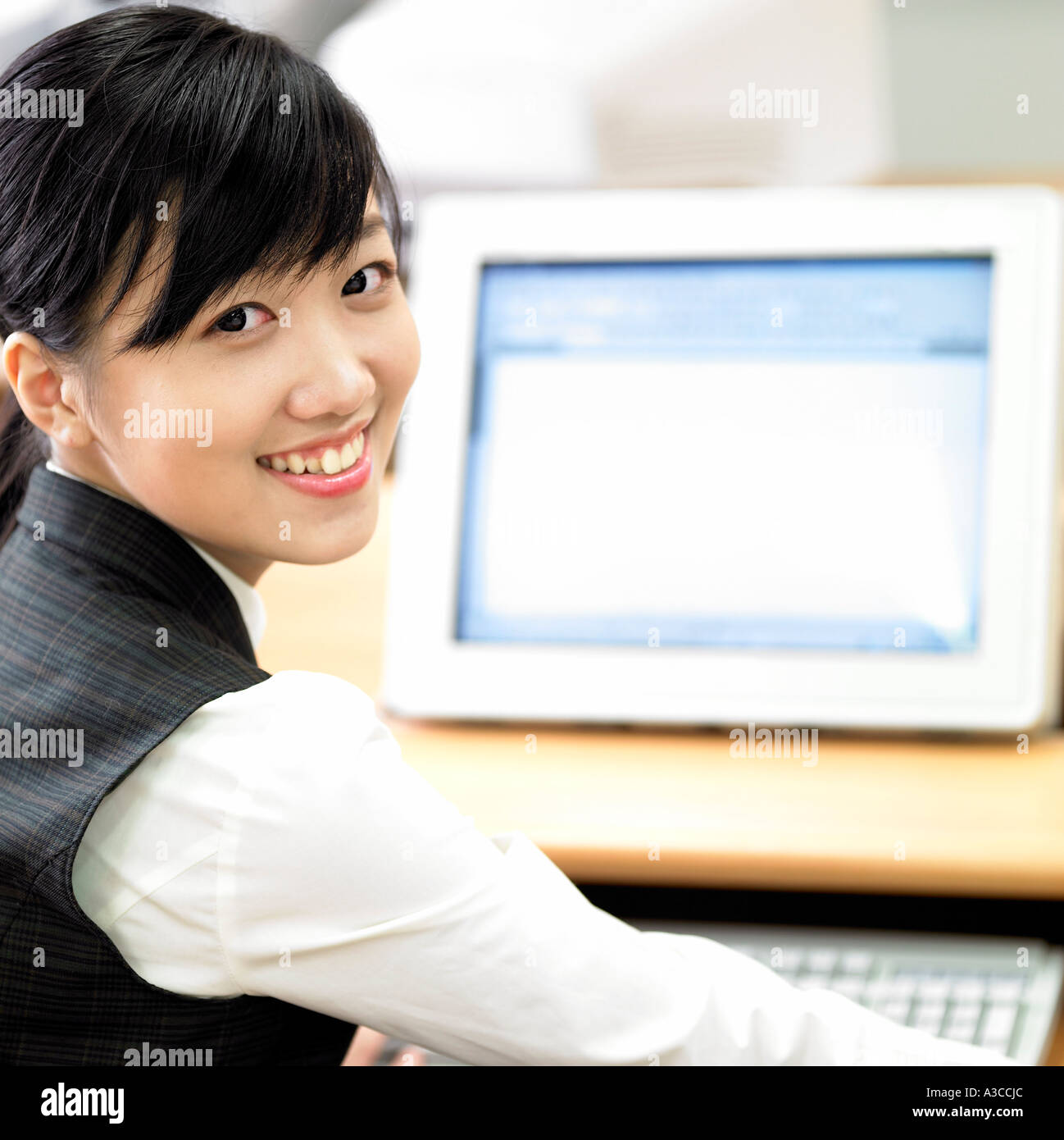 A student in the classroom with a desktop computer Stock Photo - Alamy