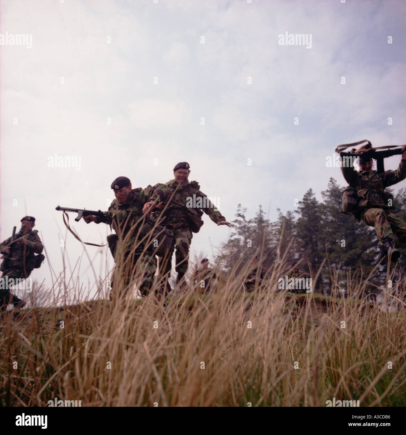 Infantry practise attack during training Stock Photo - Alamy