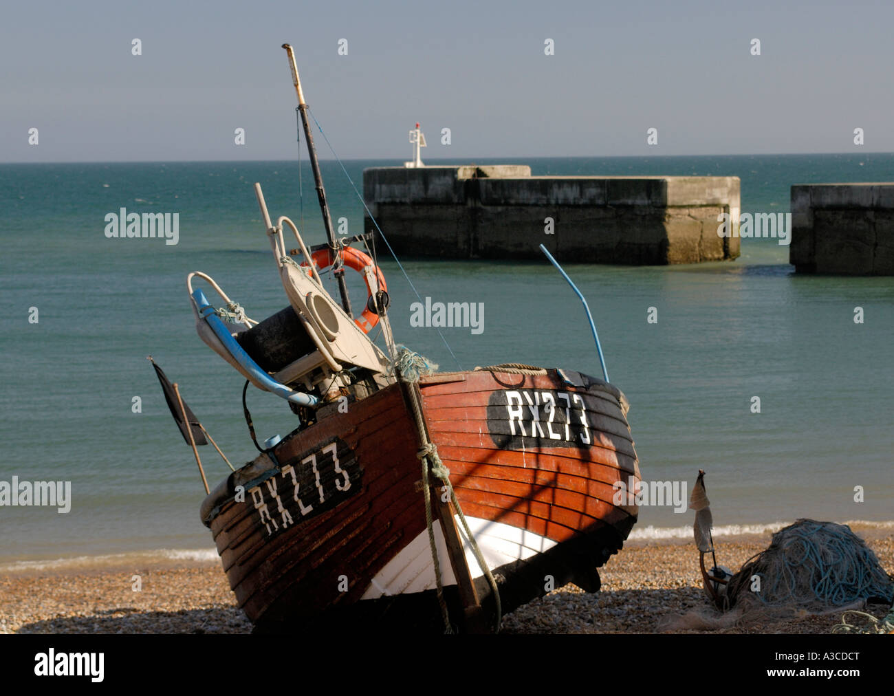 Old fashioned traditional clinker built fishing boat pulled up on the ...