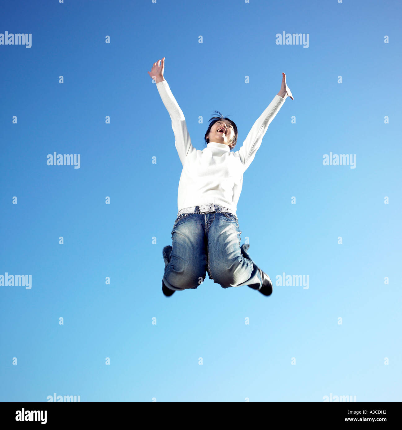 A teenage girl jumping in the air Stock Photo - Alamy
