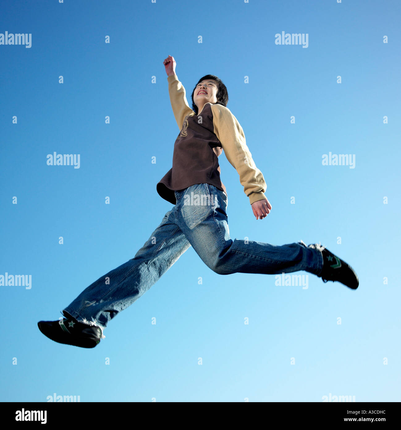 Student jumping with cheer Stock Photo - Alamy