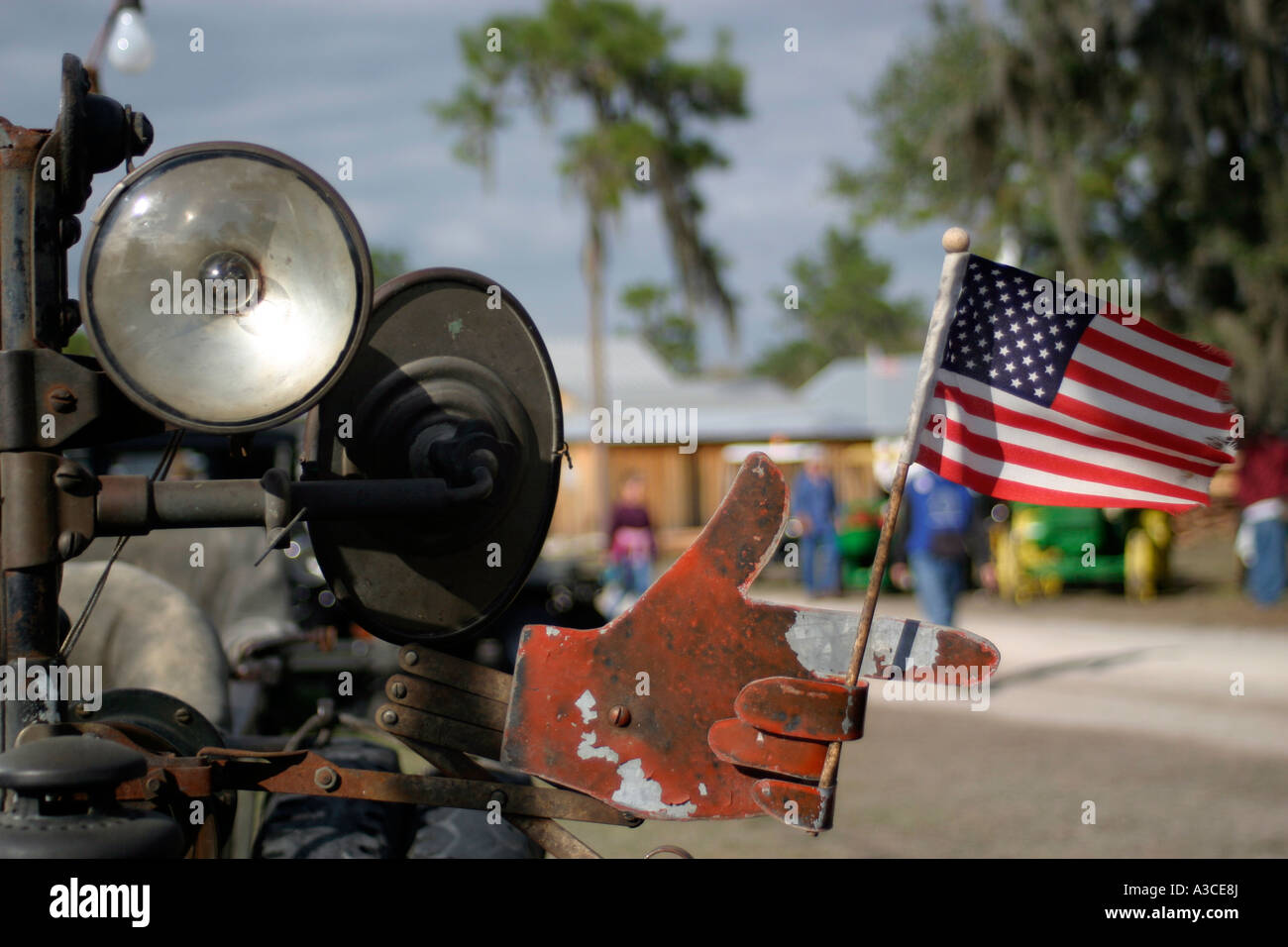 Close-up of Old Timer with American Flag Old-Timer farm implements and ...