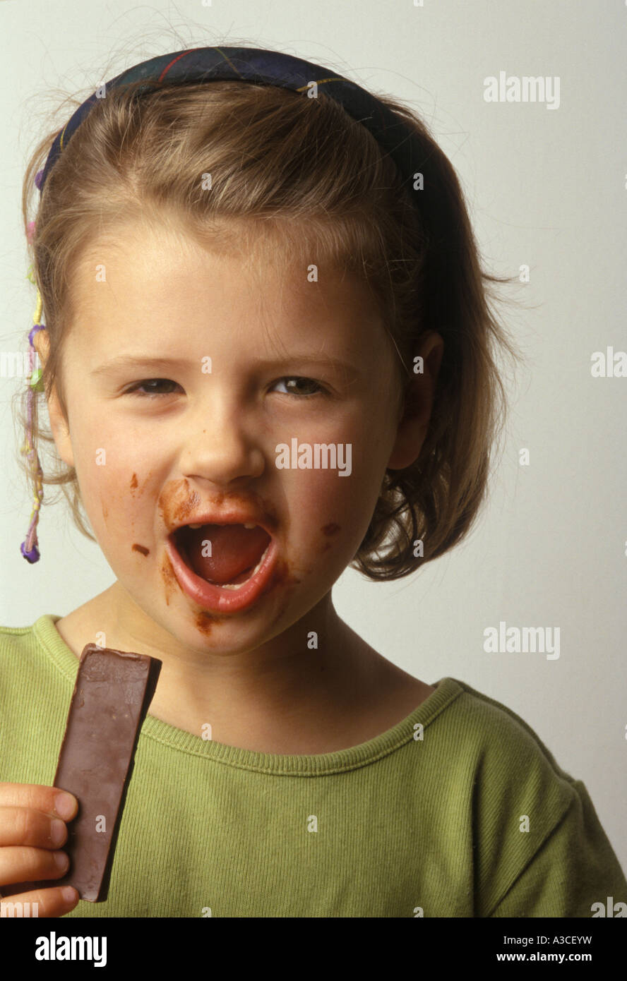 little girl with cocolate smeared over her face Stock Photo - Alamy